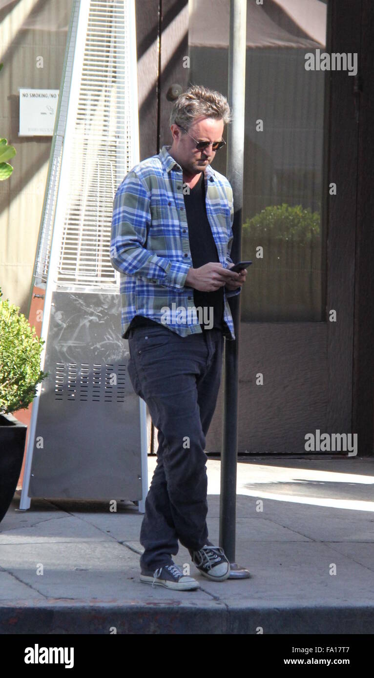 Matthew Perry seen using his phone whilst he wait for his Audi car ...