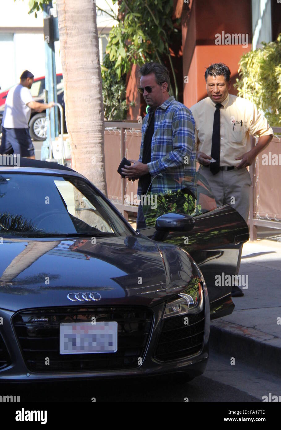 Matthew Perry seen using his phone whilst he wait for his Audi car ...
