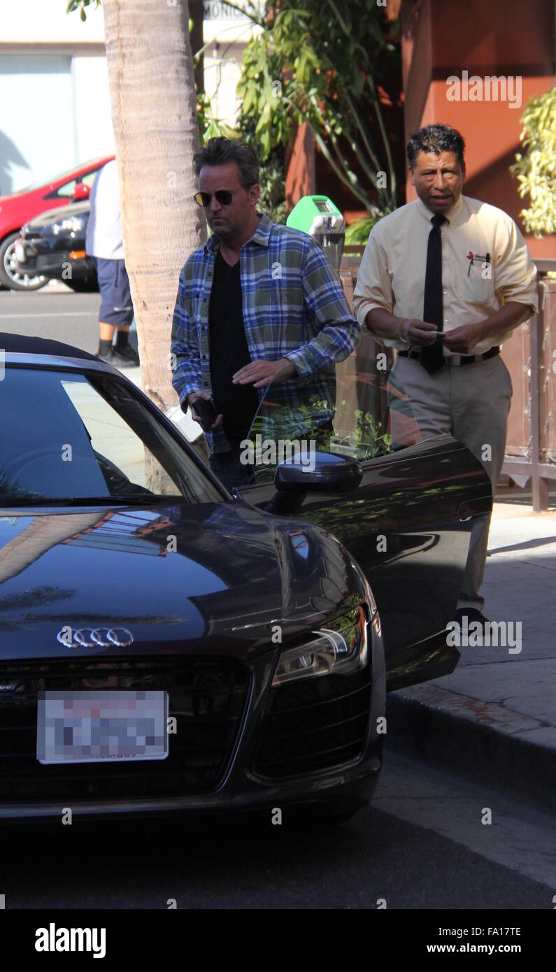 Matthew Perry seen using his phone whilst he wait for his Audi car ...