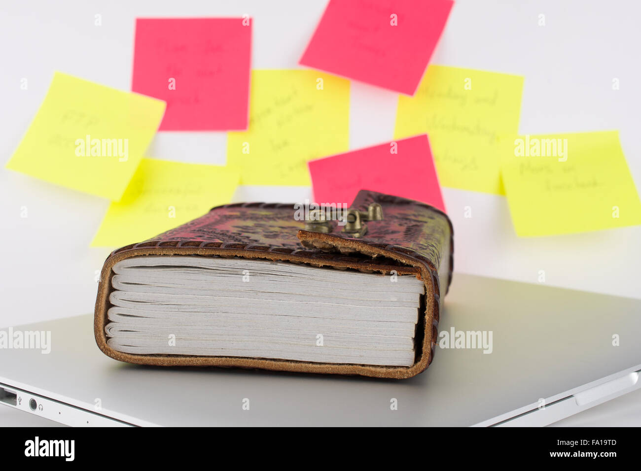 Notebook on a laptop and stickers on background Stock Photo - Alamy