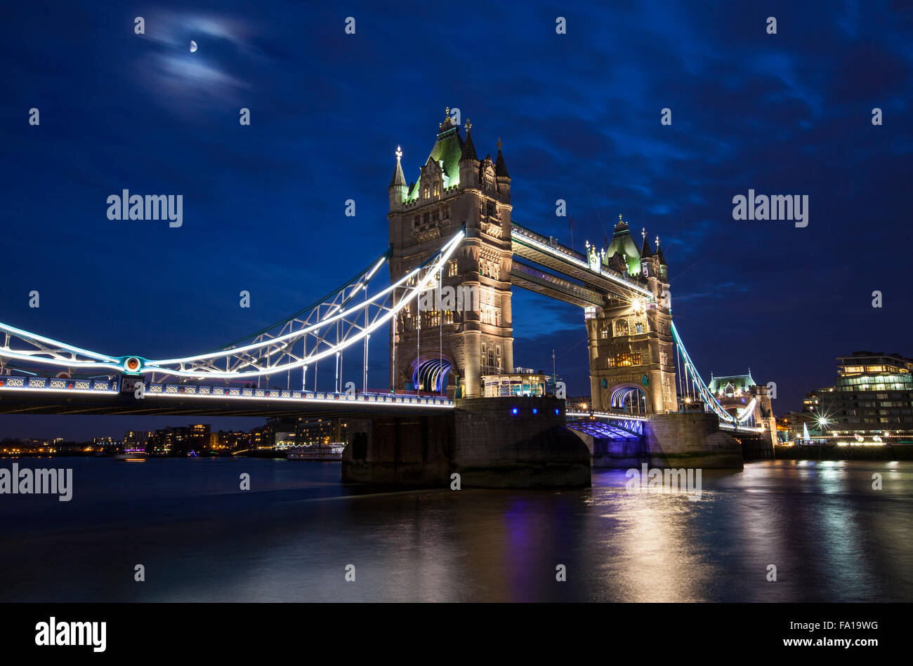 A dusk-time view of the magnificent Tower Bridge spanning over the ...