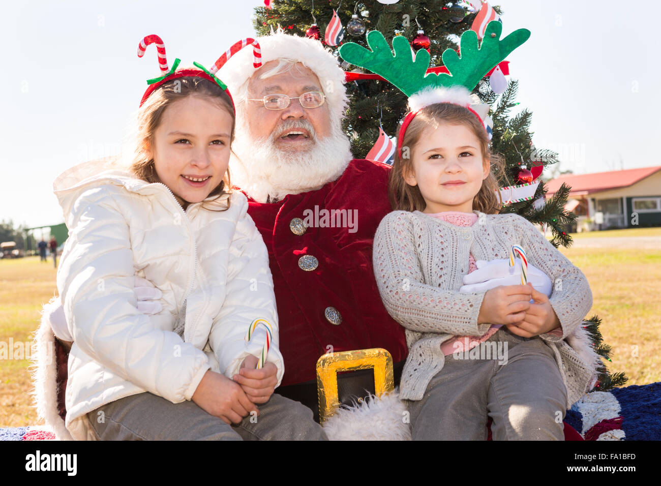 Santa Claus sits with Catherine (R) and Caroline Cruz, daughters of ... Santa Claus sits with Catherine (R) and Caroline Cruz, daughters of ...