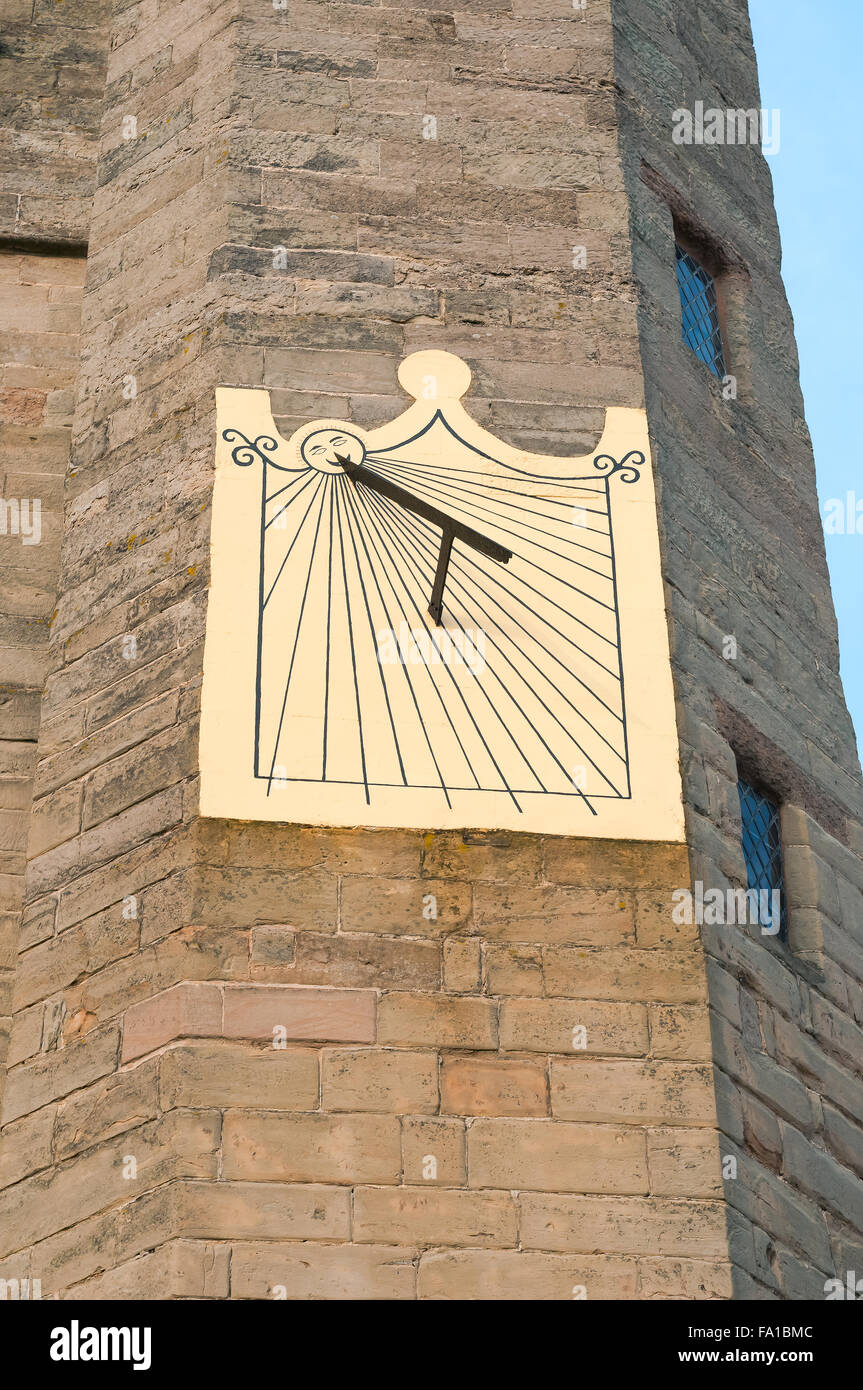 Medieval sundial on stone castle tower UK England Stock Photo - Alamy