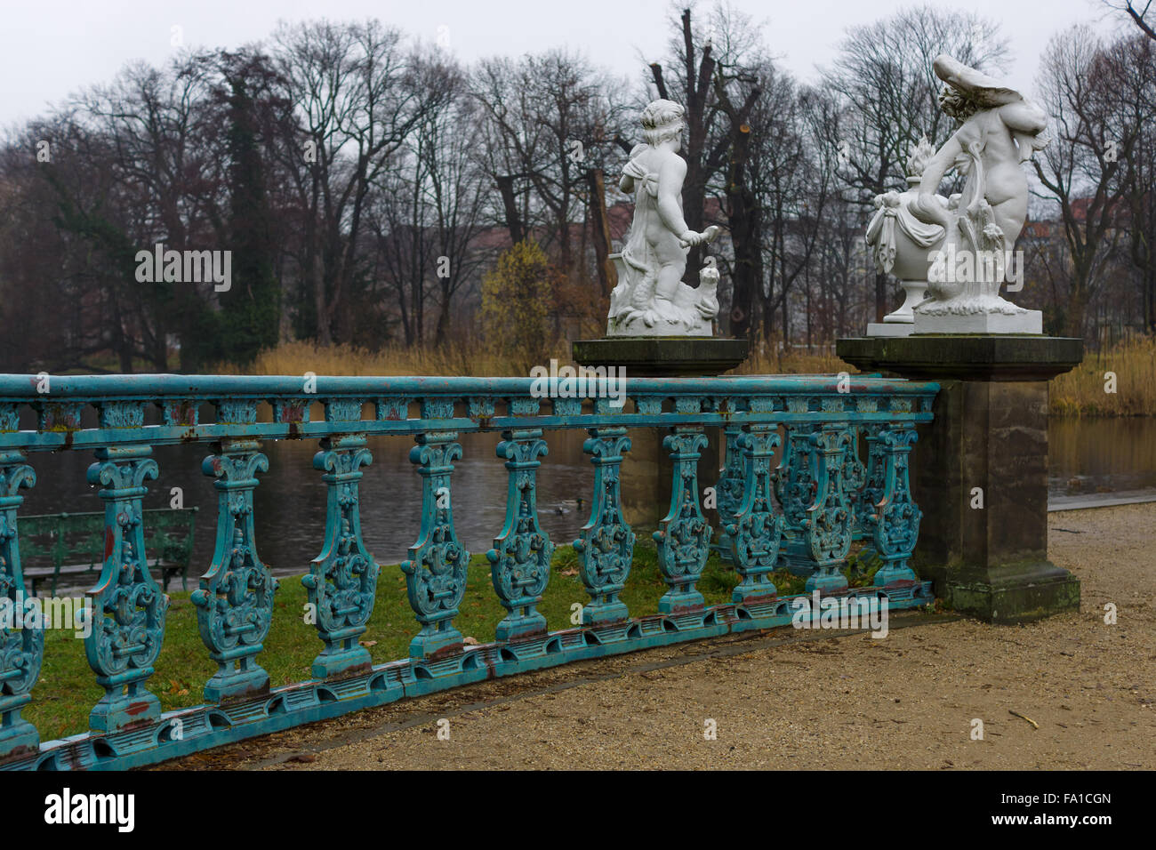 Fence the pond and marble statues in the park of Charlottenburg Palace ...