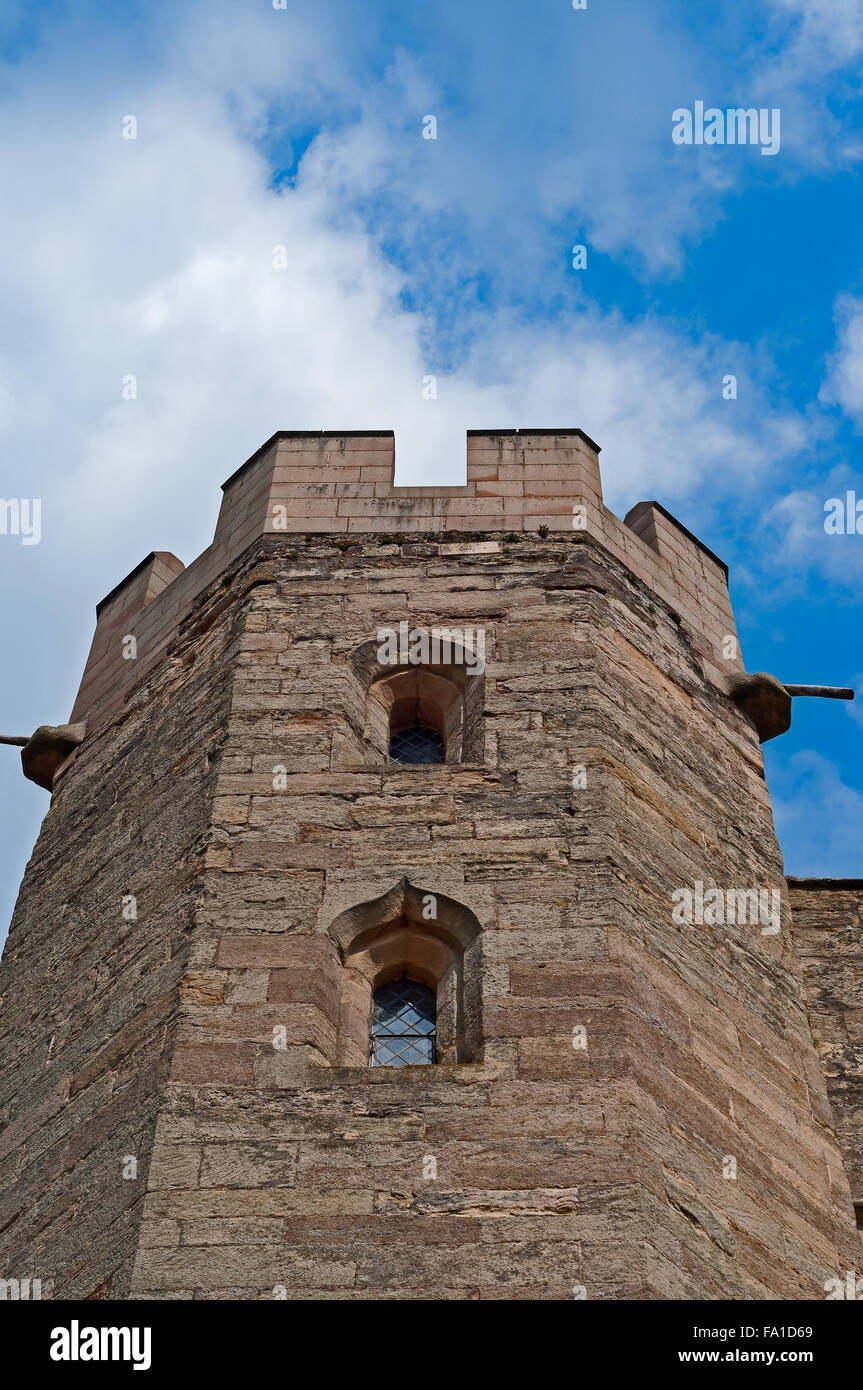 Exterior view of an antique medieval English castle tower facade from ...