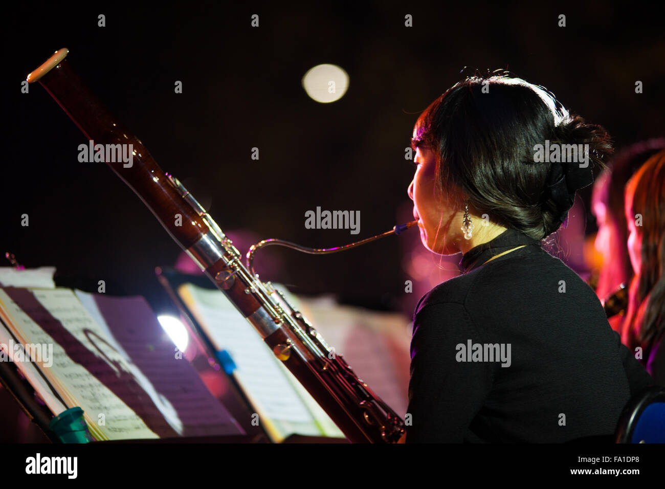 Rear view of unidentified Korean female member of a symphany orchestra ...