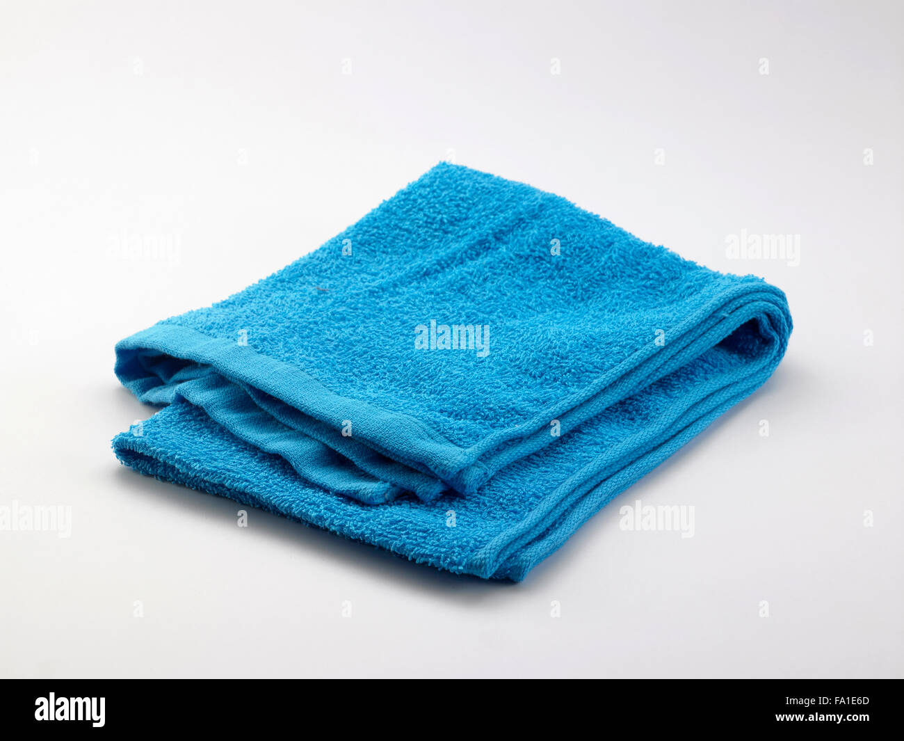 Folded towel isolated on white background Stock Photo - Alamy