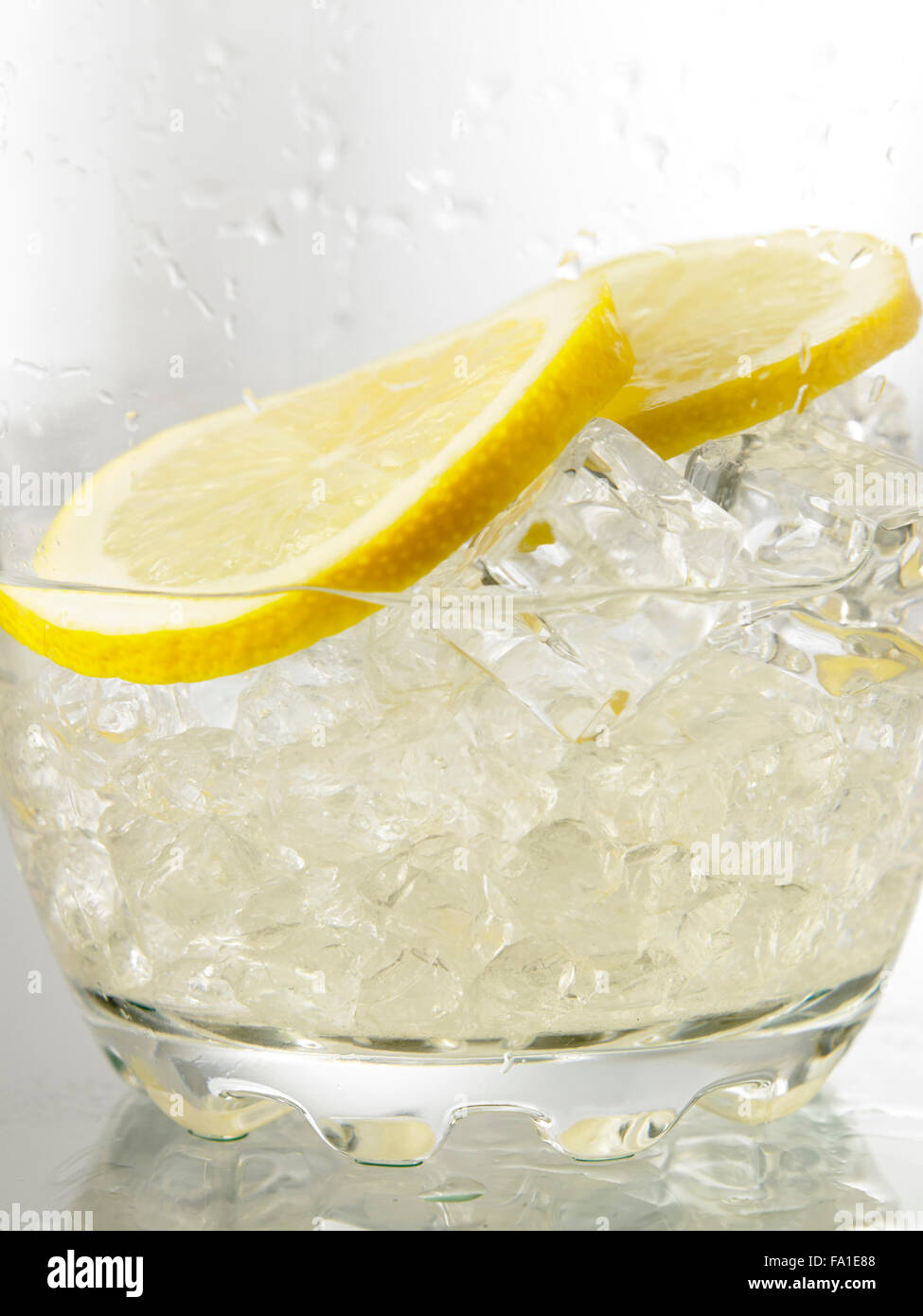 Refreshing Ice Cold Water with Lemon ready to drink Stock Photo - Alamy