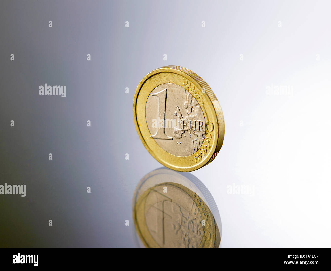 one euro coin on the glass top Stock Photo - Alamy