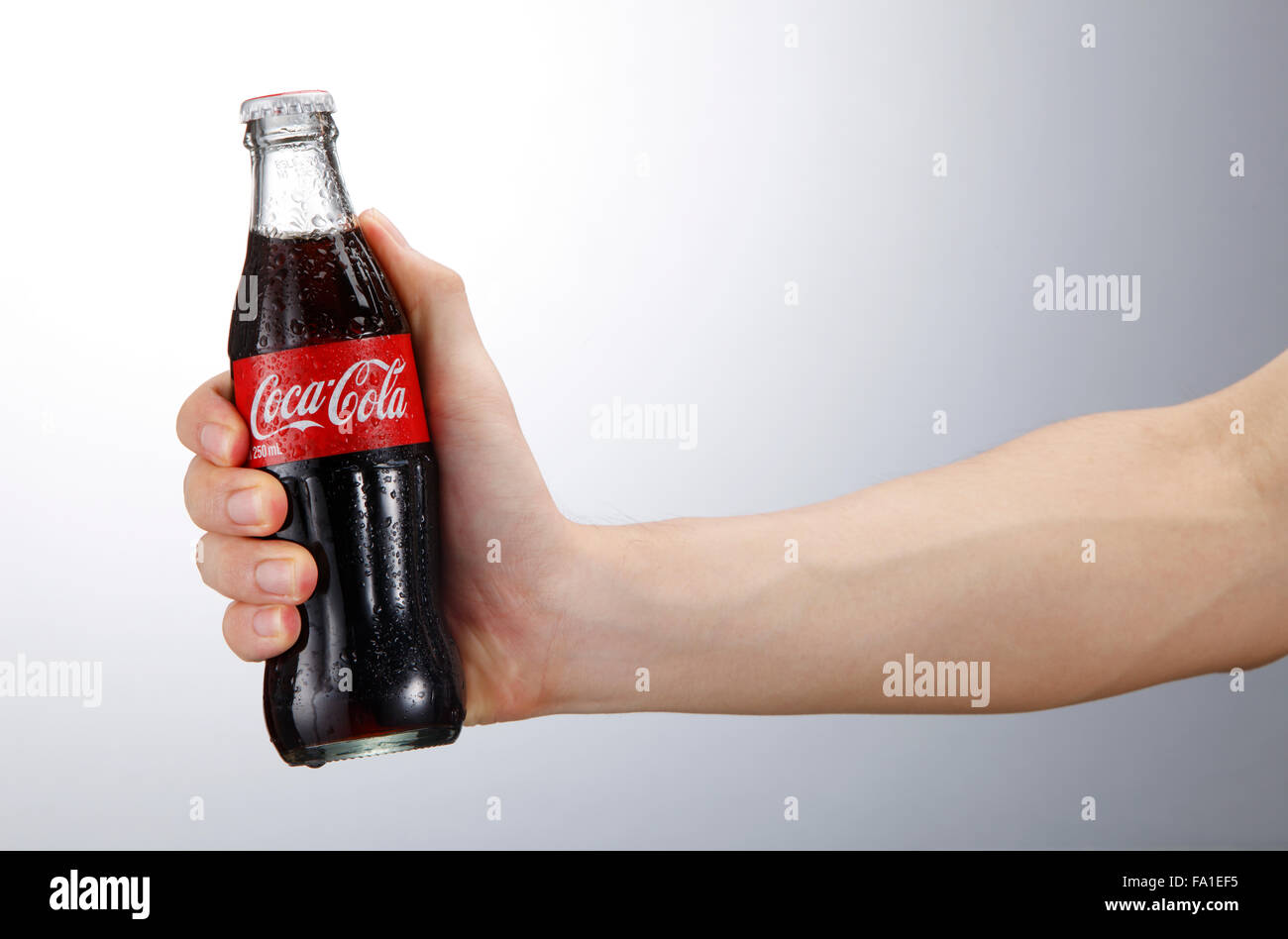 Hand holding coca cola bottle hi-res stock photography and images - Alamy