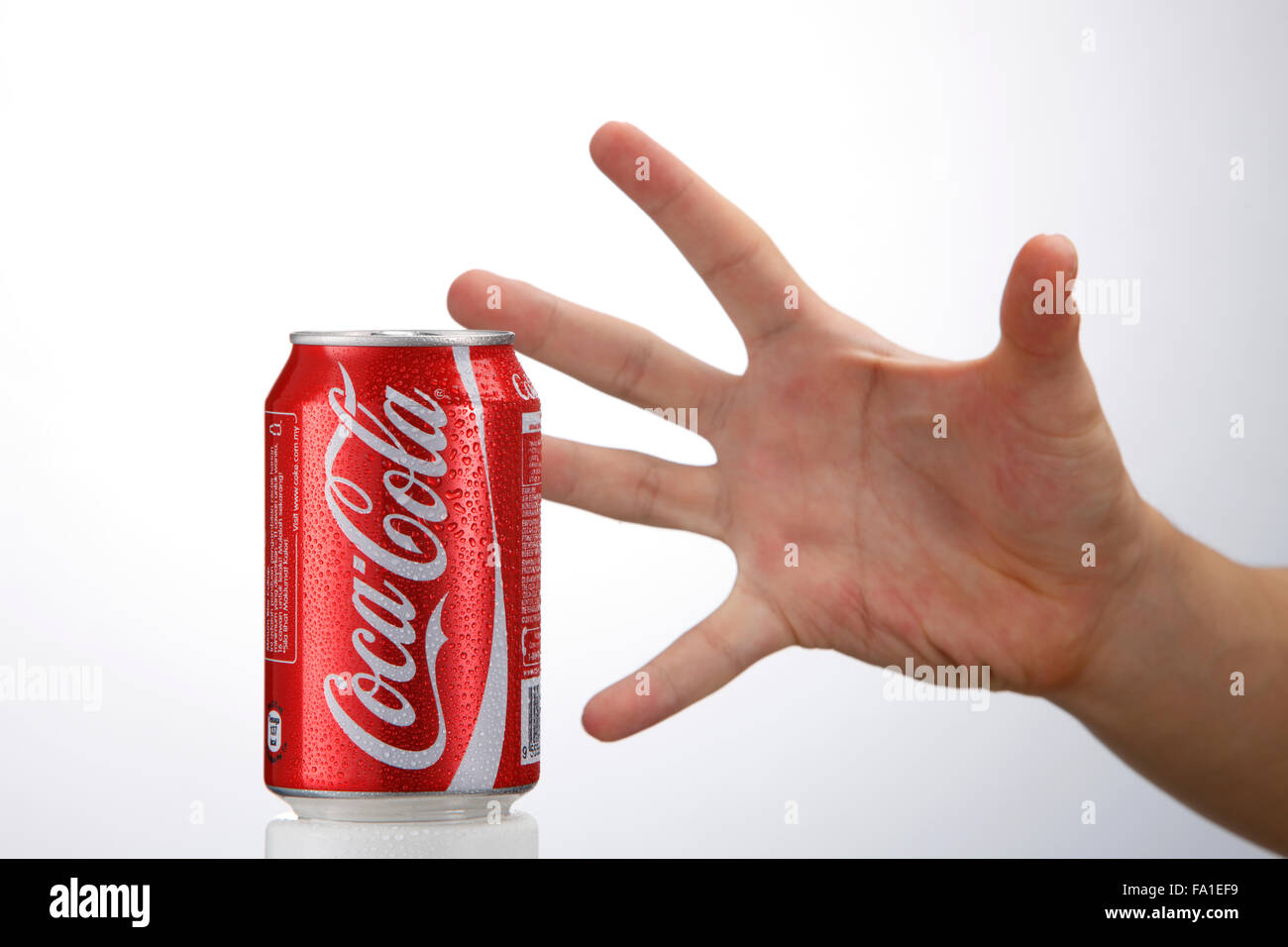 Kuala Lumpur,Malaysia 9th April 2015, hand holding a red Coca Cola can ...