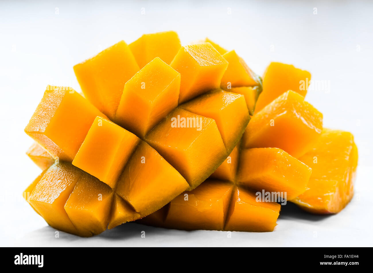 Mango sliced on the skin ready to eat organic healthy snack juicy fresh ...
