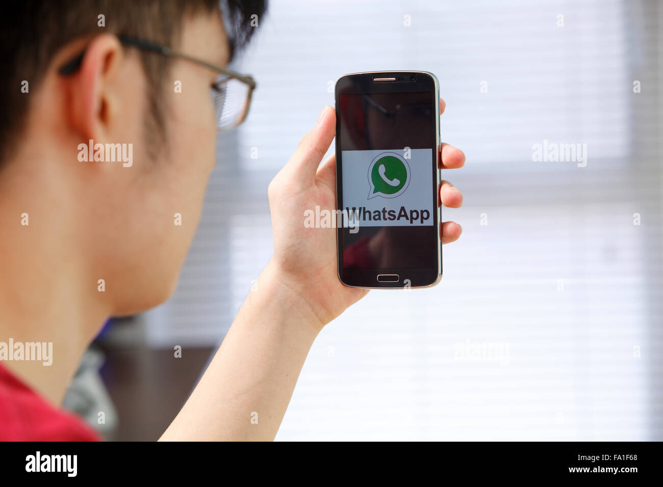 Kuala Lumpur,Malaysia 9th April 2015,Man holding a smartphone with ...