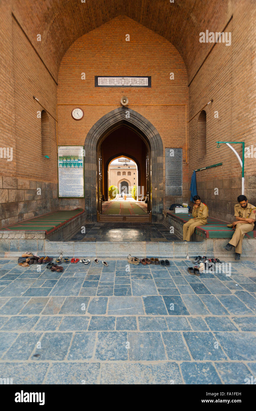 Guards sitting, securing the front entrance of the Main Mosque, Jama ...