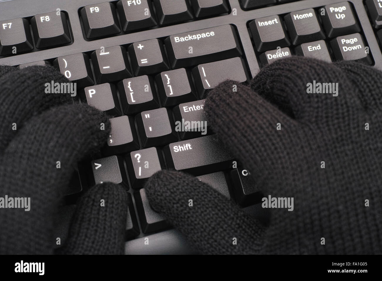 Hacker hands at keyboard gloves hi-res stock photography and images - Alamy