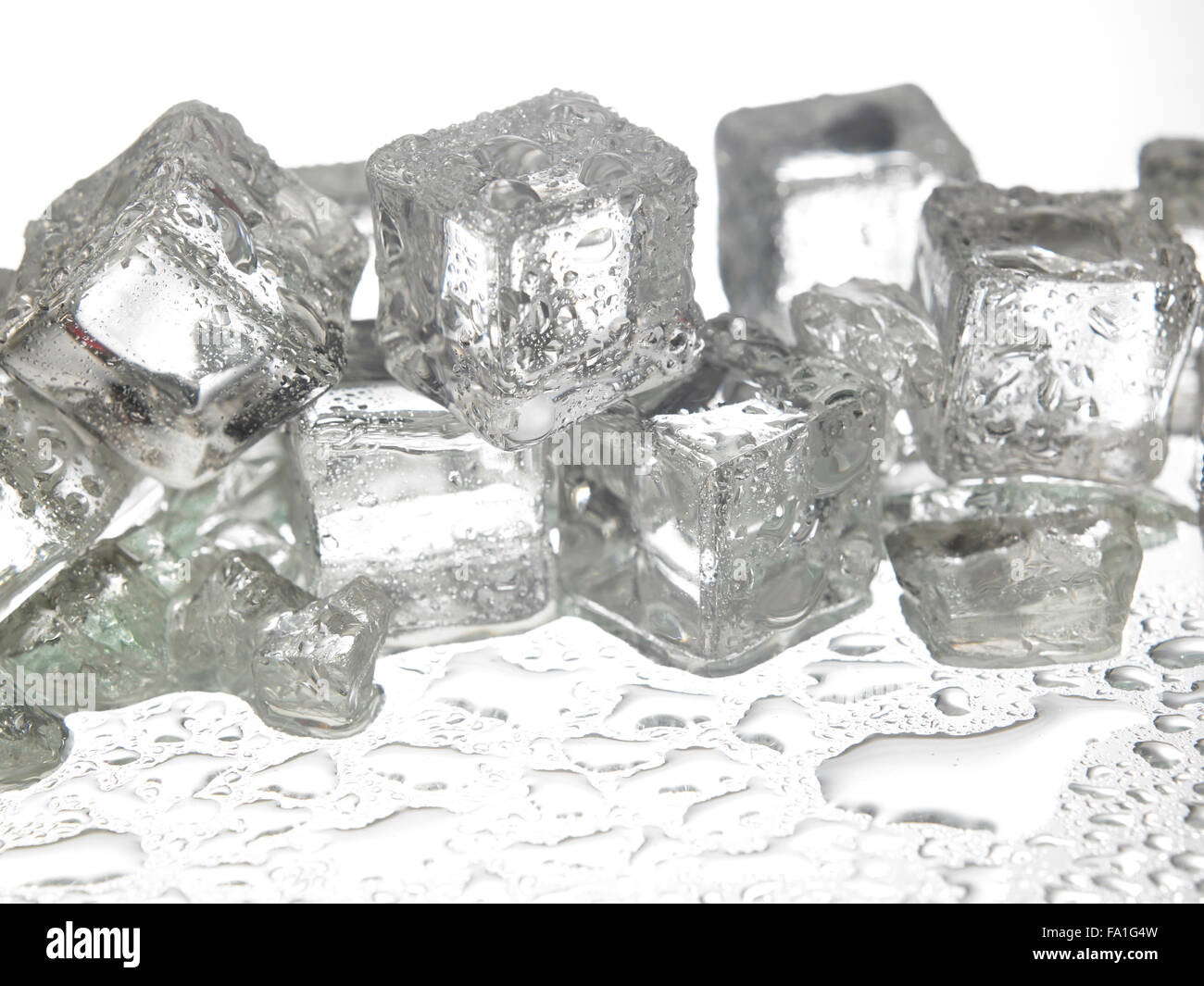 cold ice cubes on the white background Stock Photo - Alamy