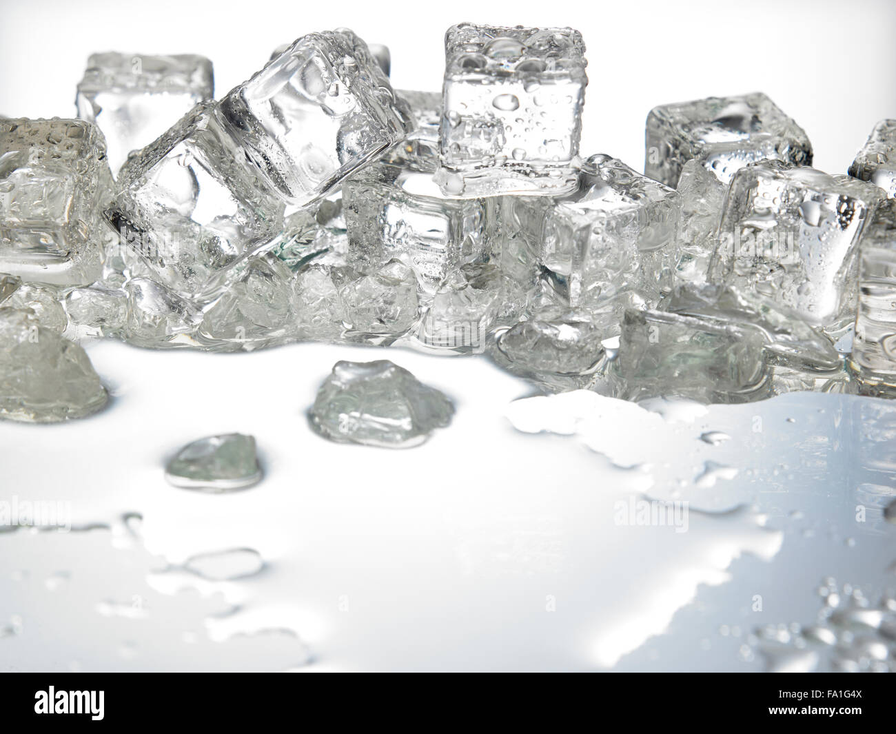 cold ice cubes on the white background Stock Photo - Alamy