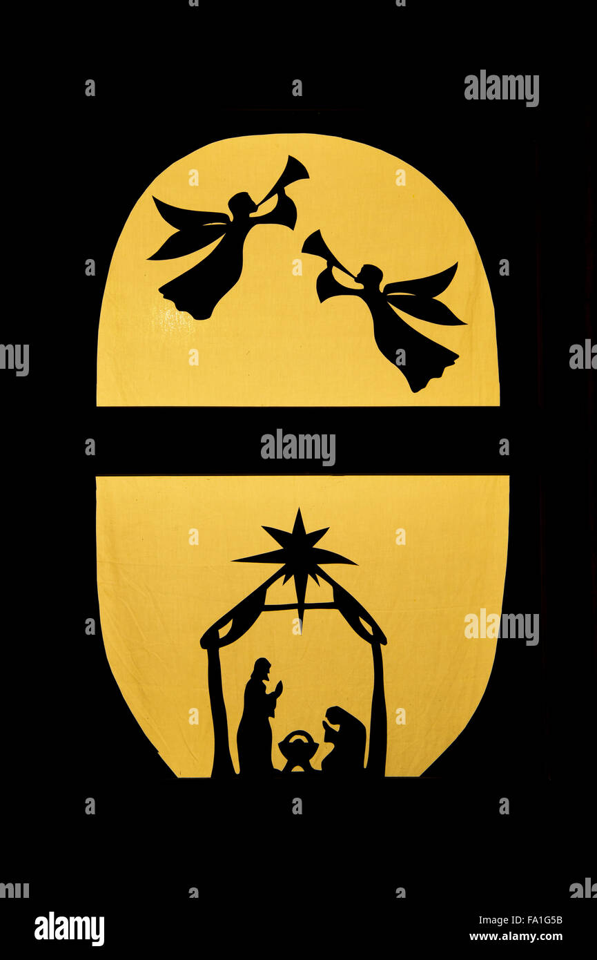 Festive Christmas house window display. Nativity and angels silhouette ...