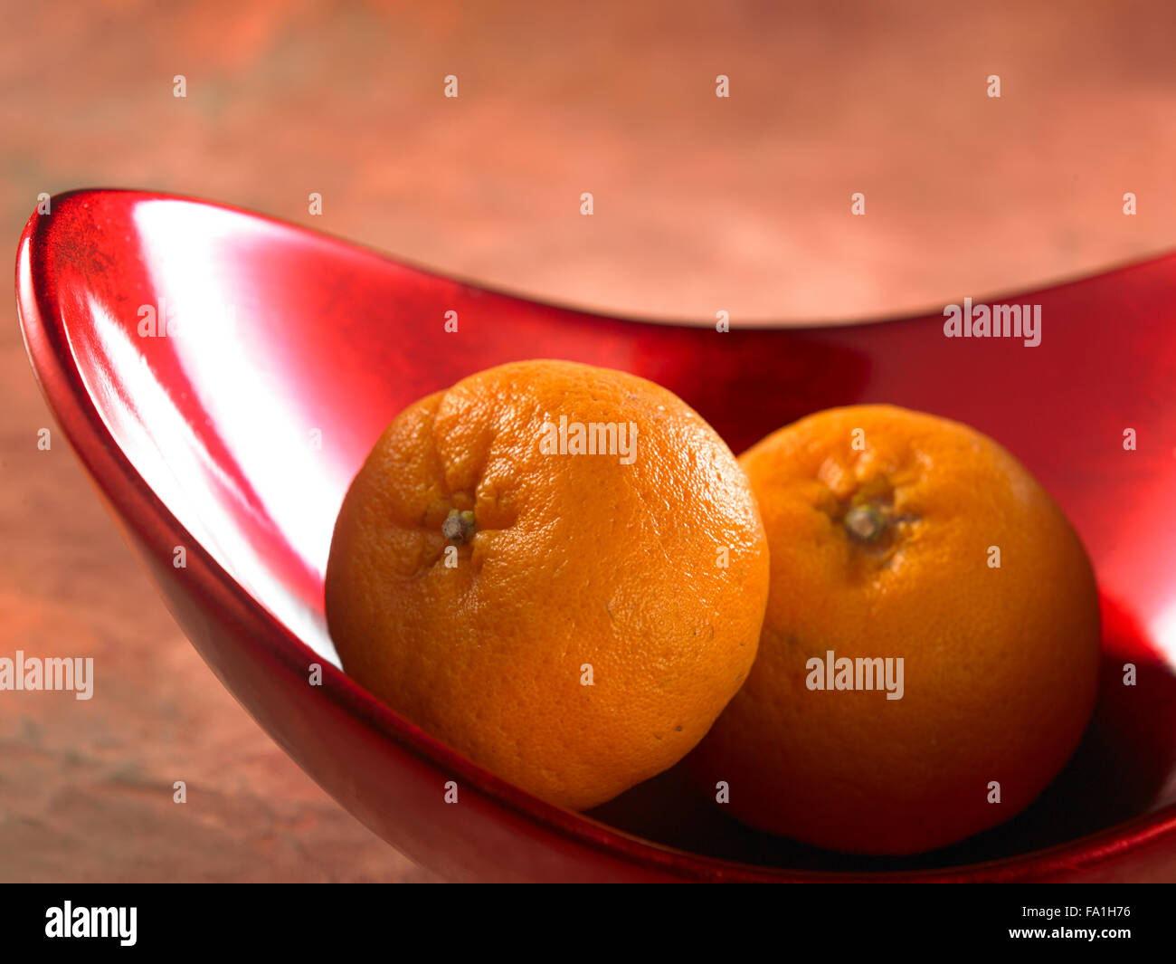 mandarin oranges on the color background Stock Photo - Alamy