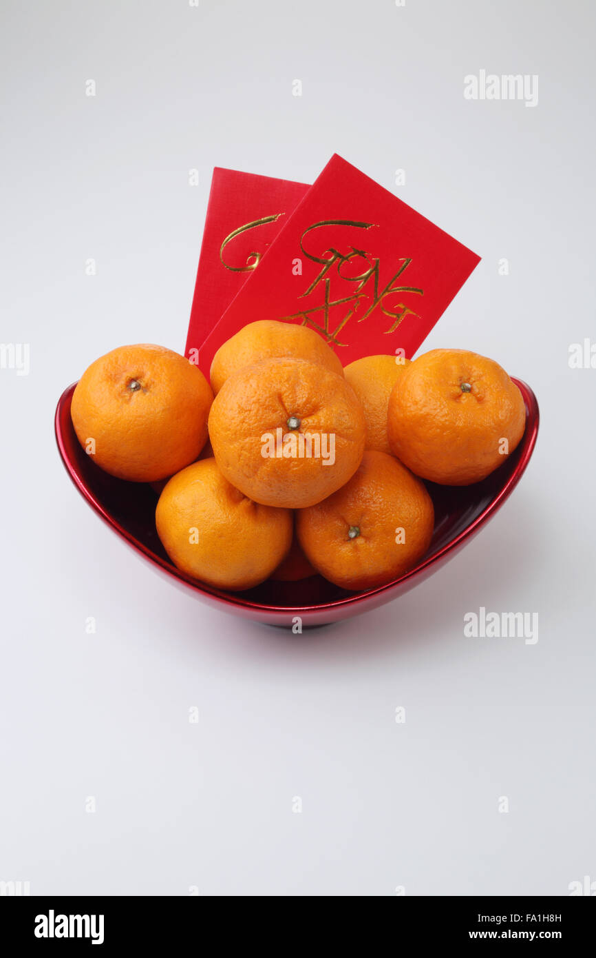 chinese new year celebration mandarin oranges with ang pao Stock Photo ...