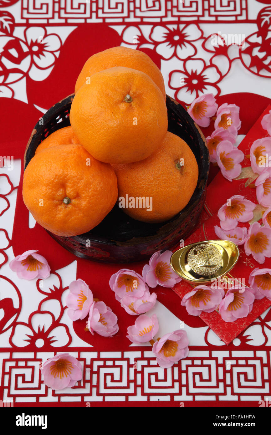 mandarin oranges on the red paper cutting Stock Photo - Alamy