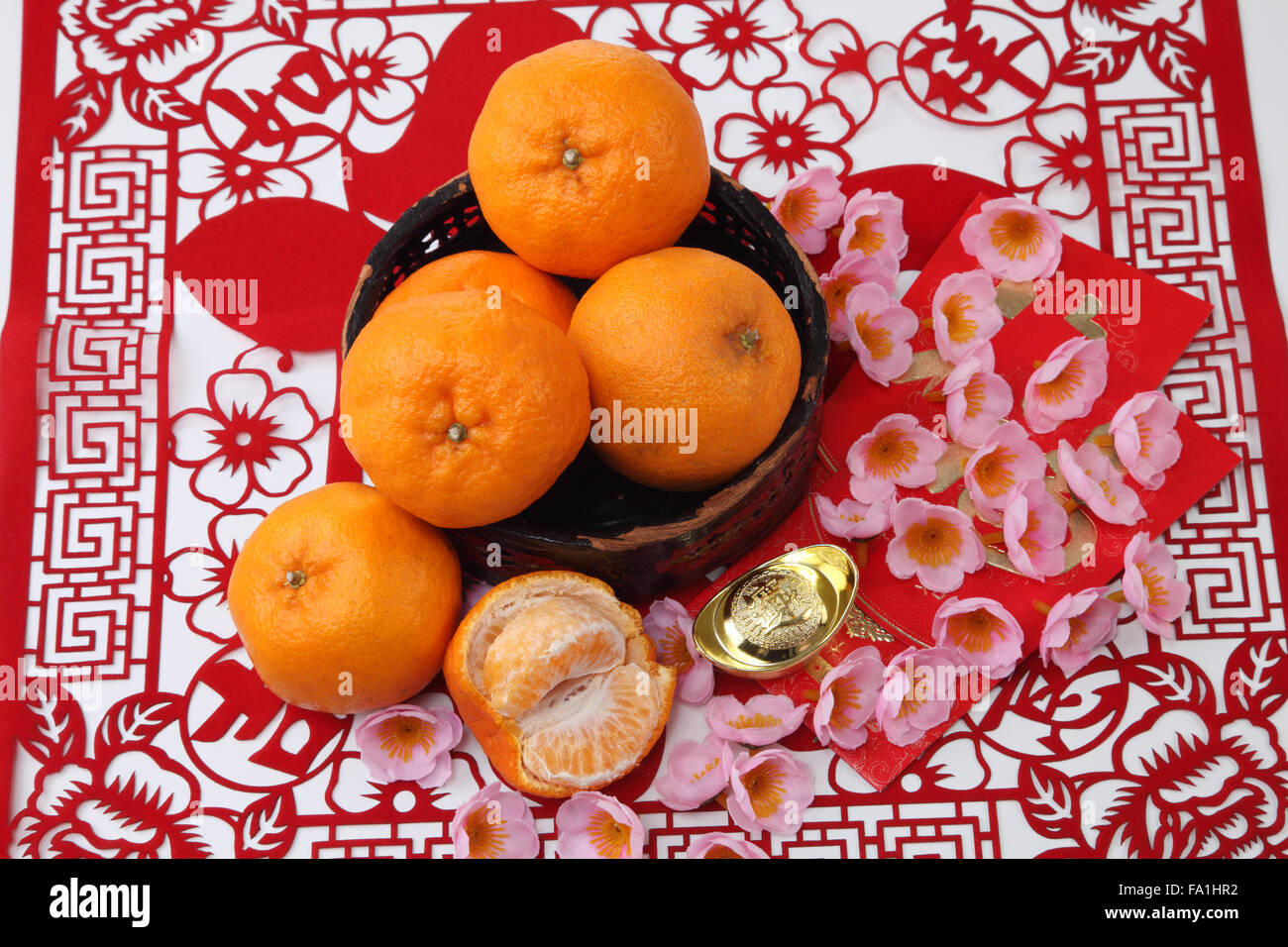 mandarin oranges on the red paper cutting Stock Photo - Alamy