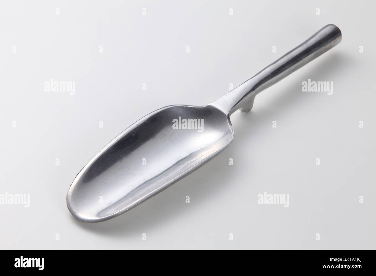 silver scoop on the white background Stock Photo - Alamy