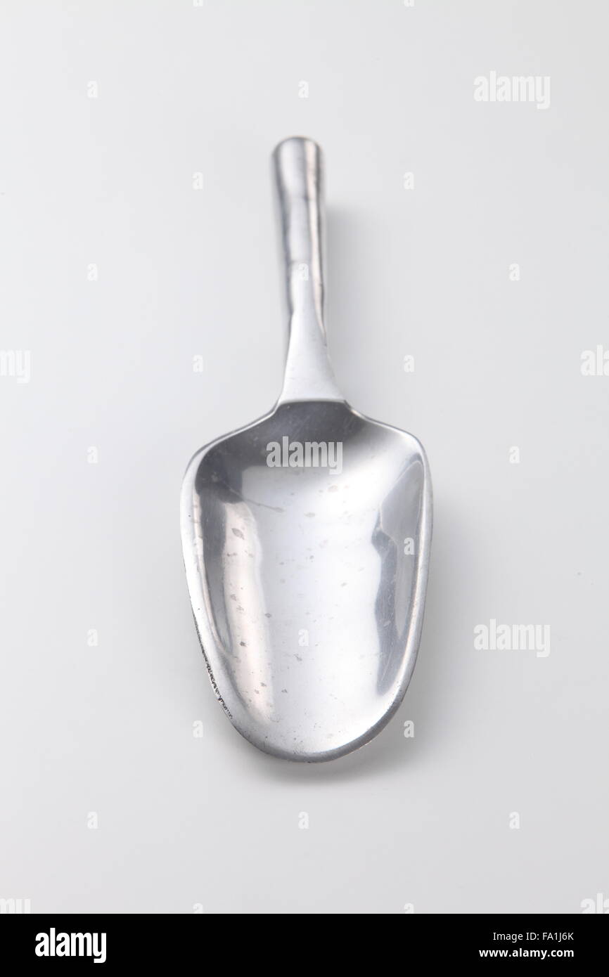 silver scoop on the white background Stock Photo - Alamy