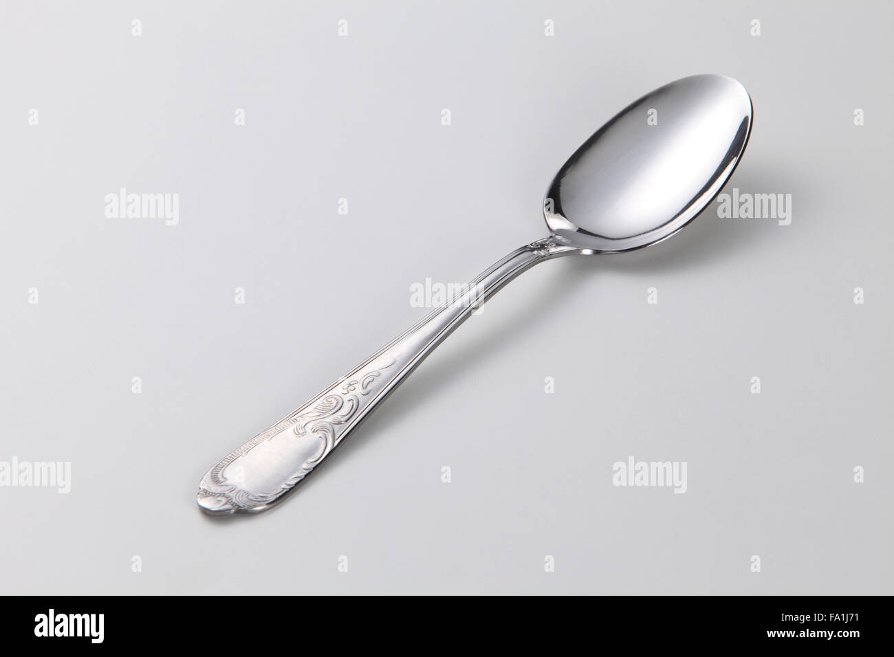 Silver spoon on white hi-res stock photography and images - Alamy