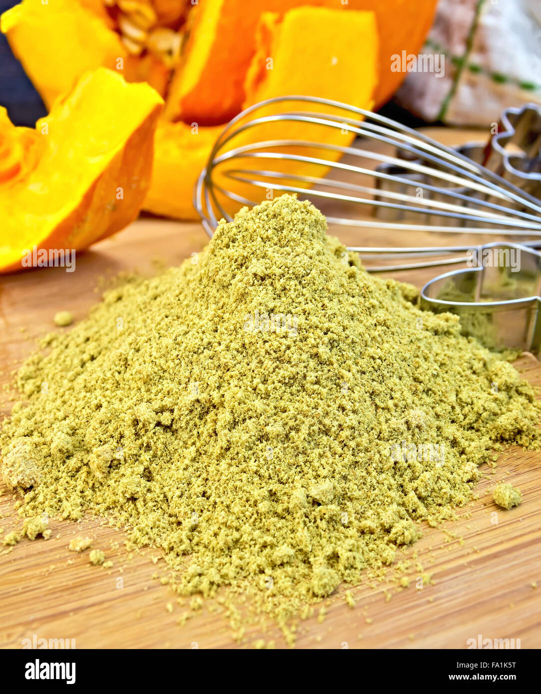 Flour pumpkin with mixer and sieve on board Stock Photo - Alamy