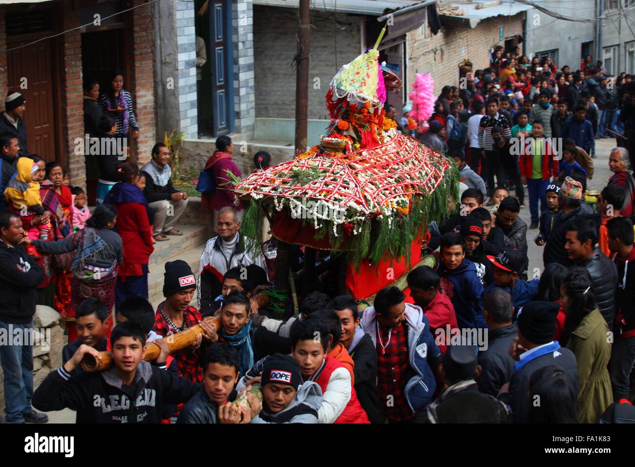 Kirtipur, Nepal. 19th Dec, 2015. Devotees carry the chariot of ...