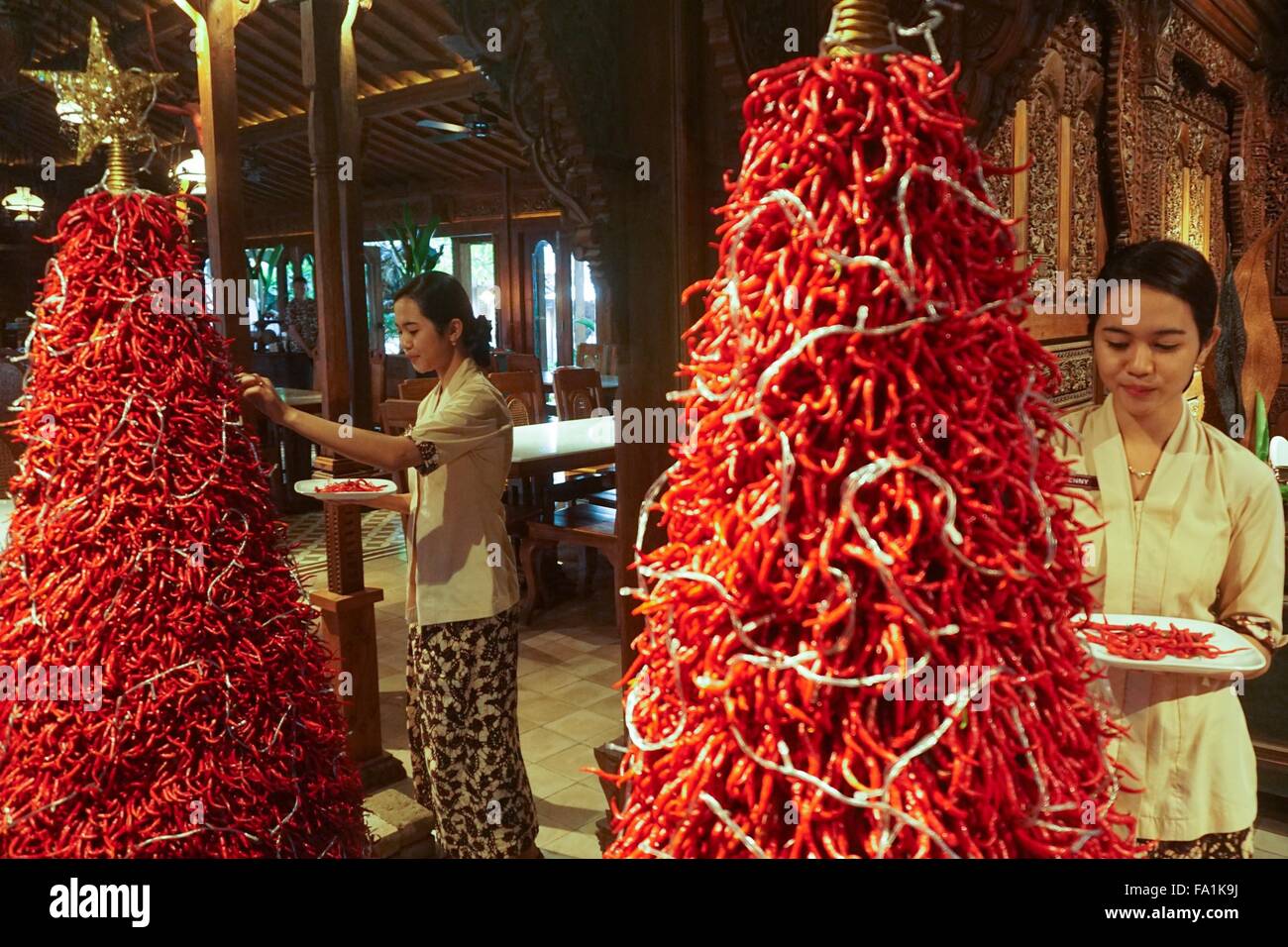 Pati, Indonesia. 19th Dec, 2015. Women decorate two-meter Christmas ...