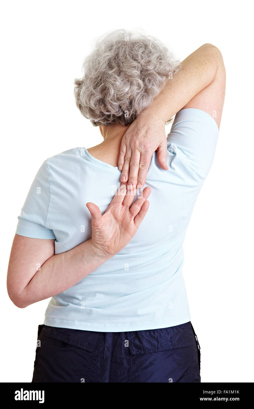 Elderly woman touching her hands behind her back Stock Photo - Alamy