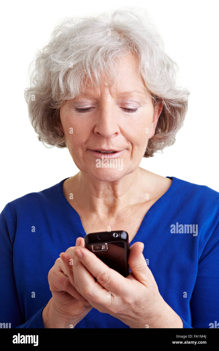 Old senior woman using the internet with her mobile phone Stock Photo ...