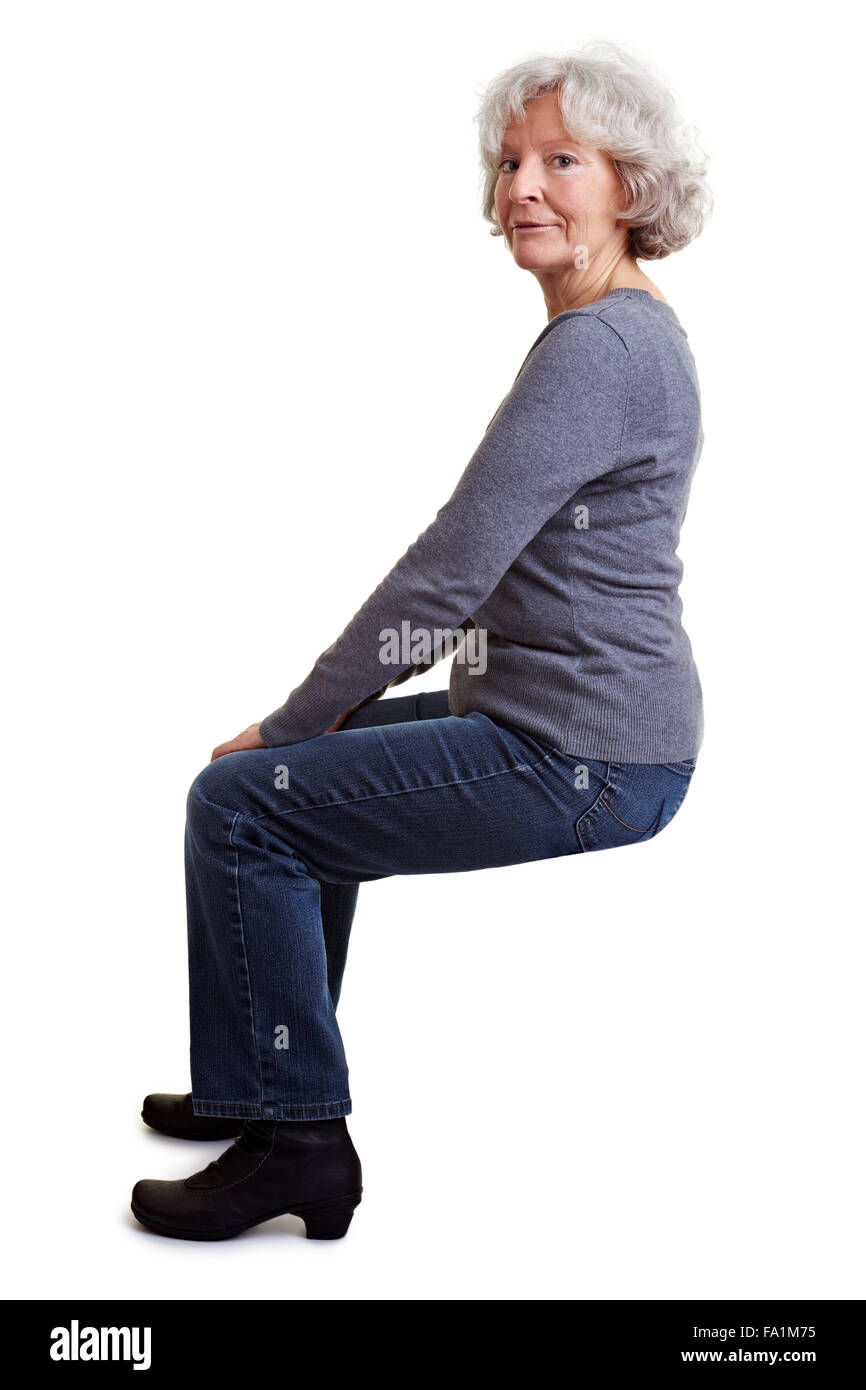 Old senior woman sitting on an imaginary chair or stool Stock Photo - Alamy