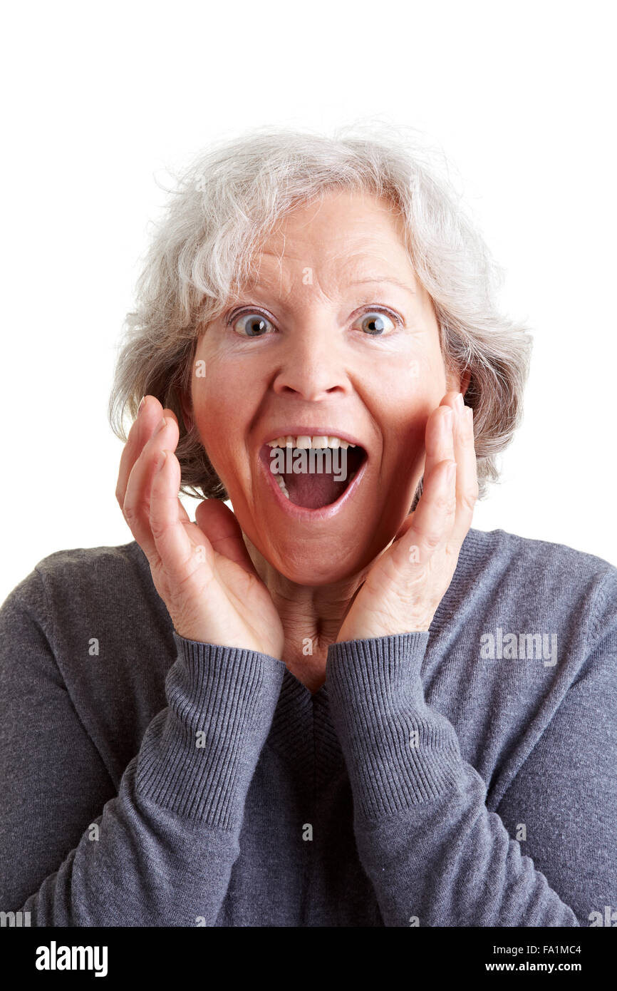 Surprised elderly woman with grey hair looking happy Stock Photo - Alamy
