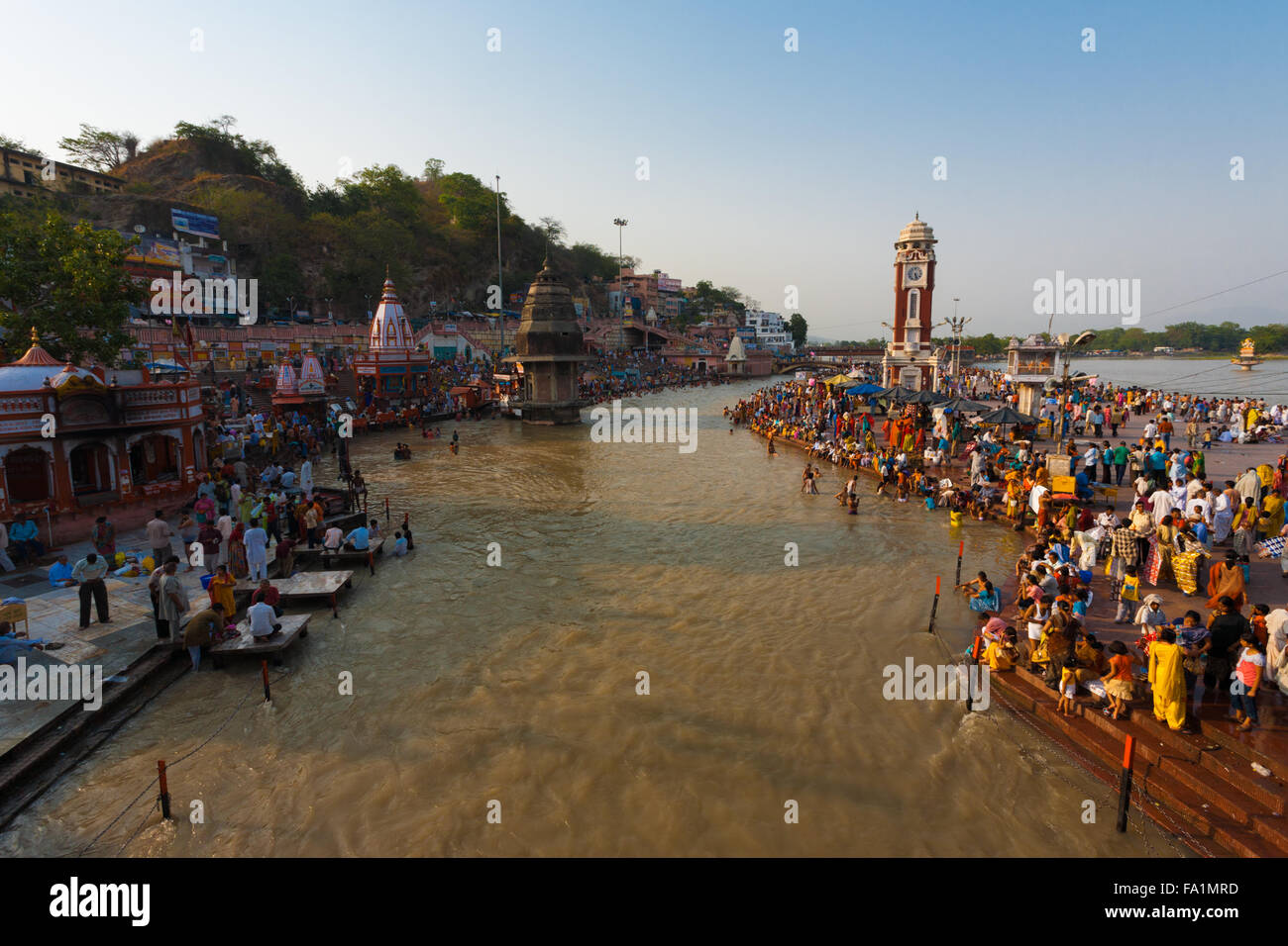 Hindus gather and taking a ritual cleansing bath in the Ganges River ...