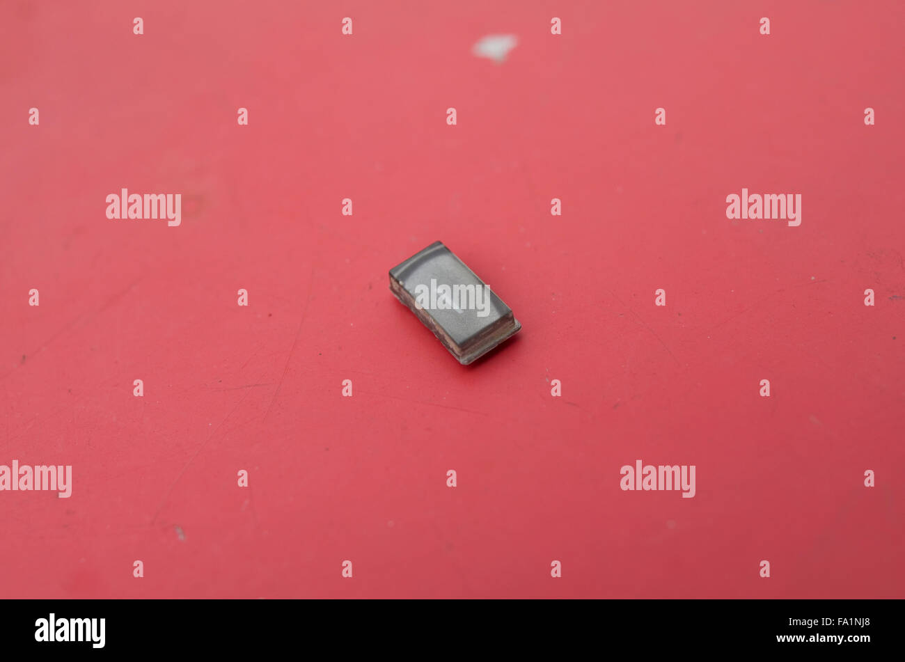 Broken hyphen or dash key from a mobile phone on a red background Stock ...