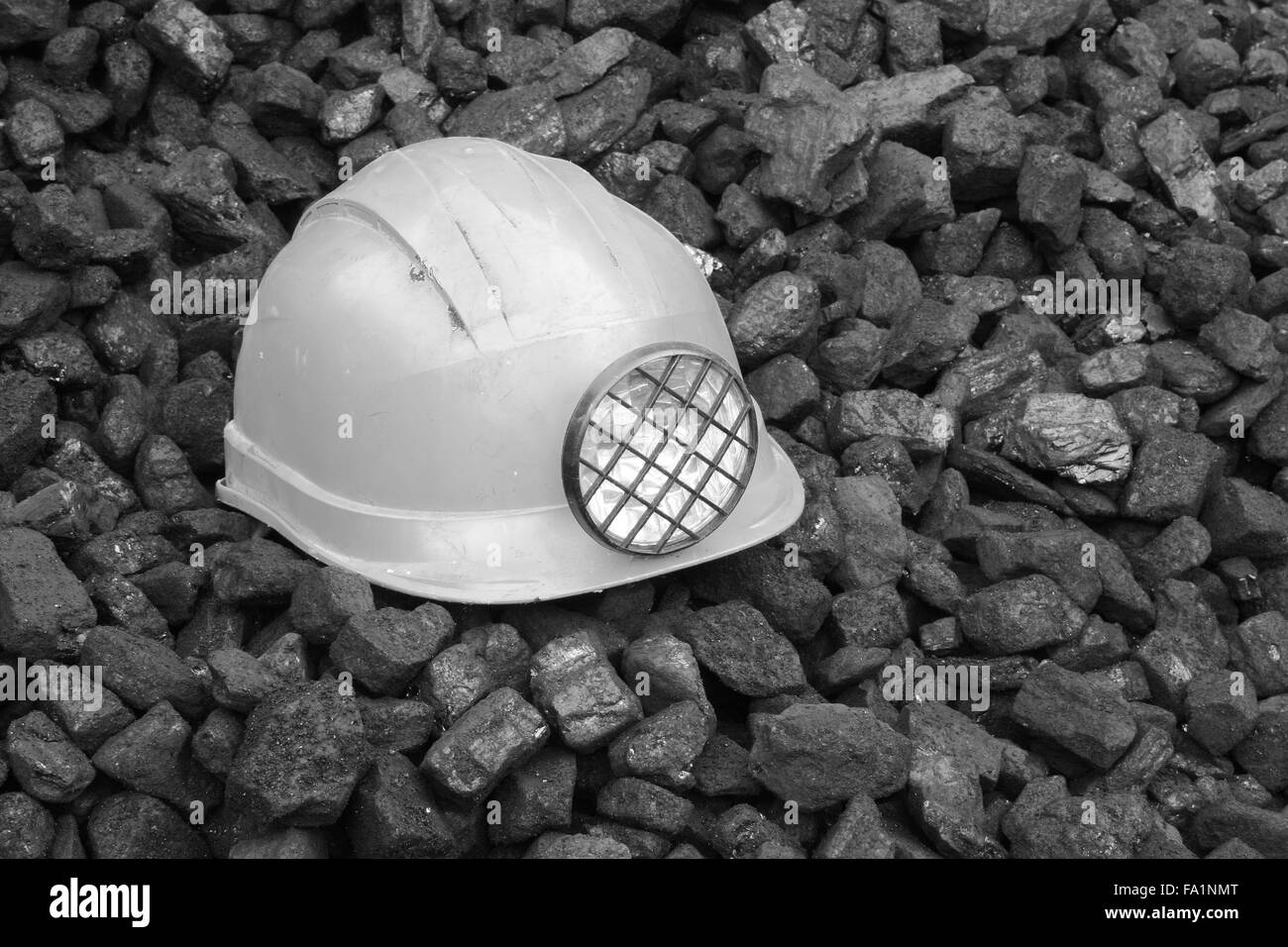 Mining helmet in the background heap of coal, black and white photo ...