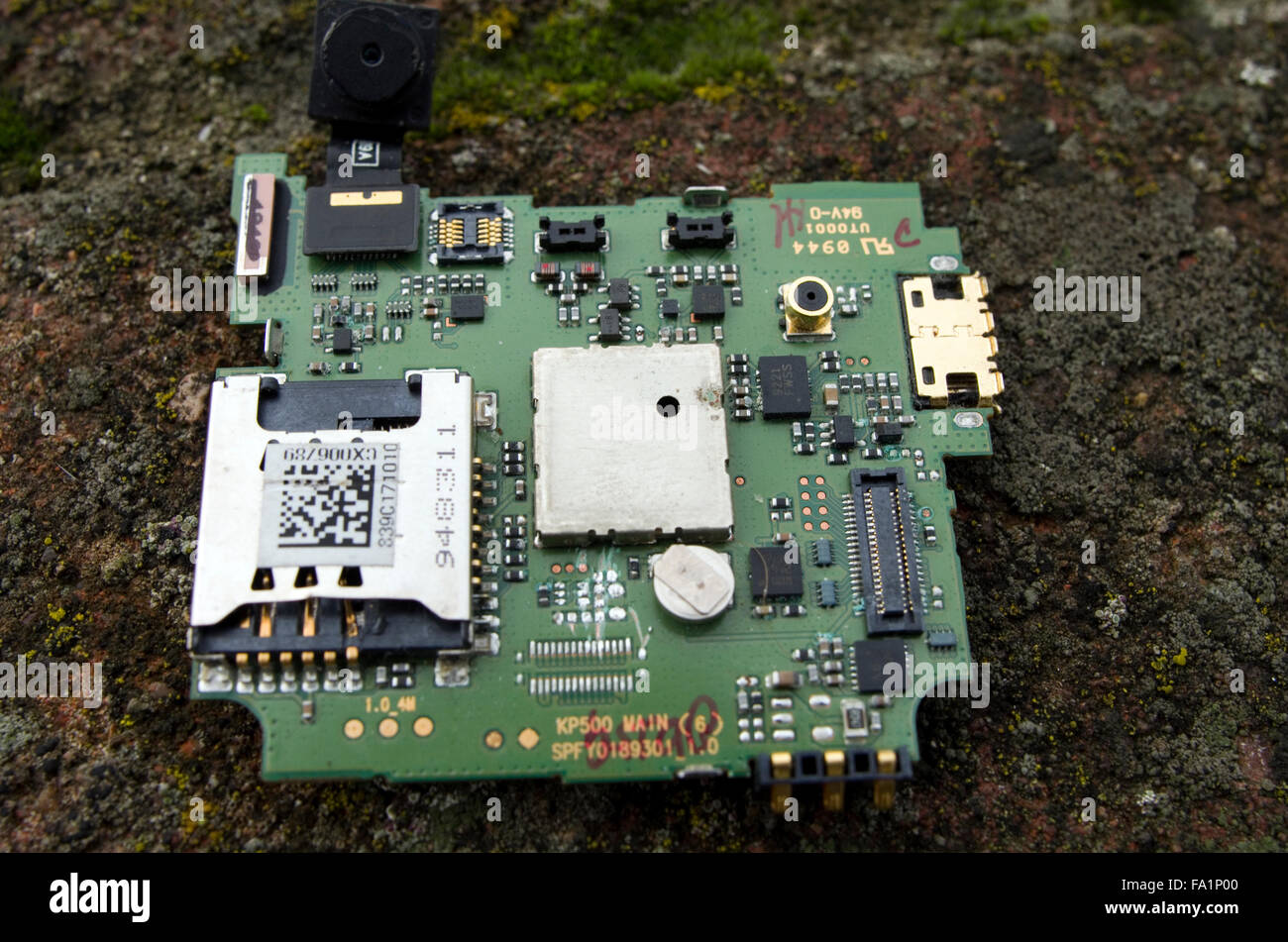 A pile of broken pieces of mobile phones and phone batteries Stock ...