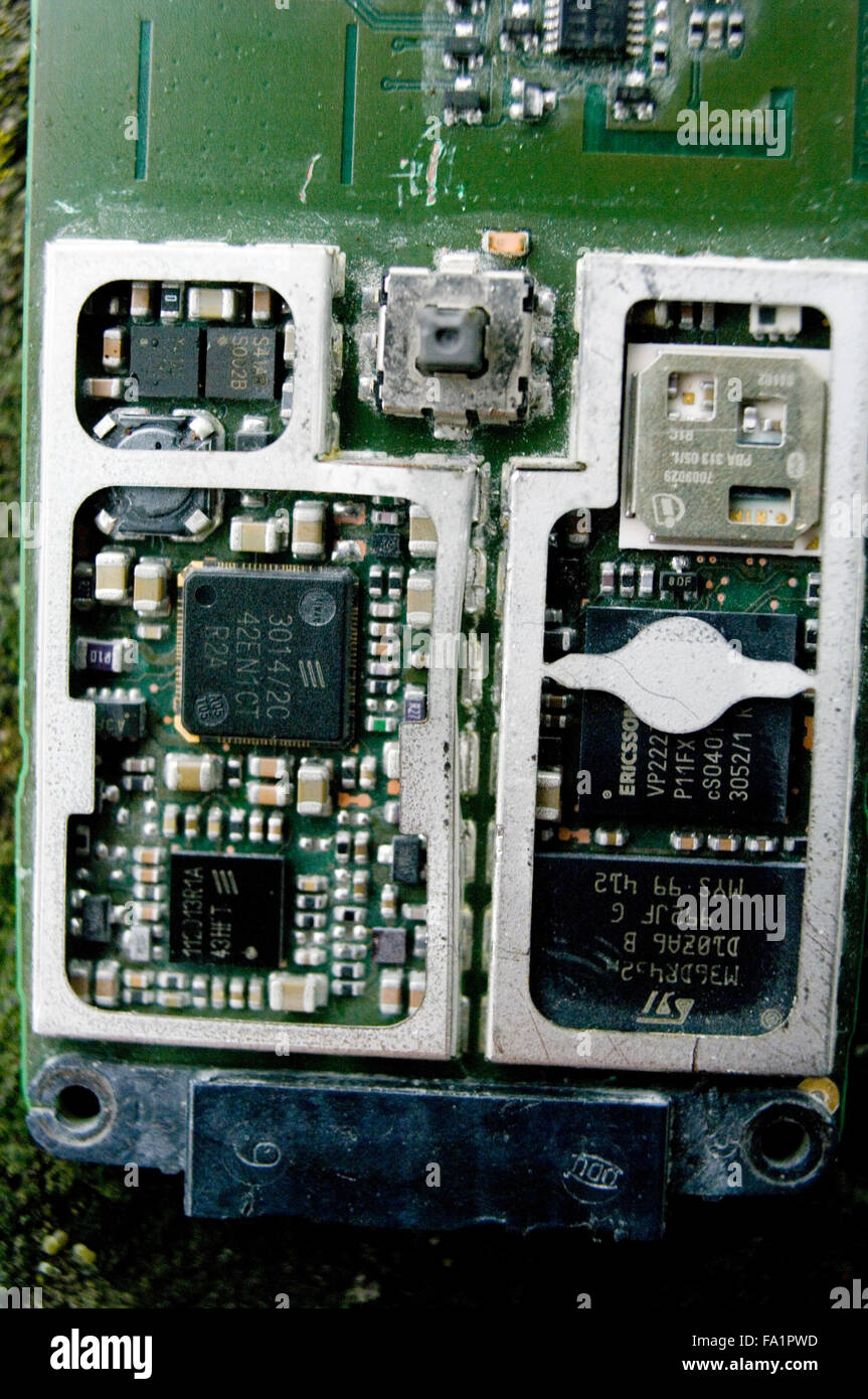 A pile of broken pieces of mobile phones and phone batteries Stock ...