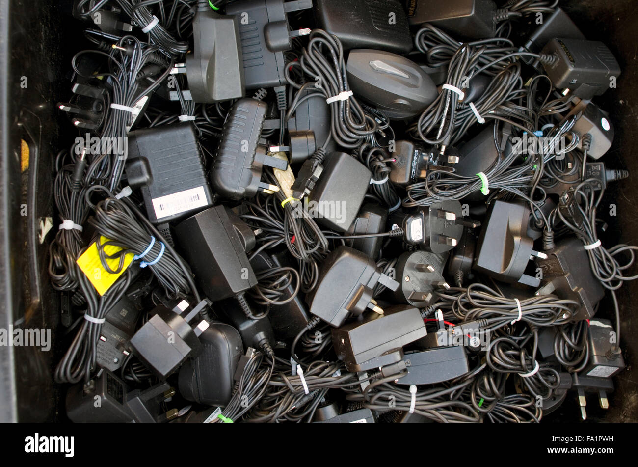 A pile of mobile phone chargers Stock Photo - Alamy