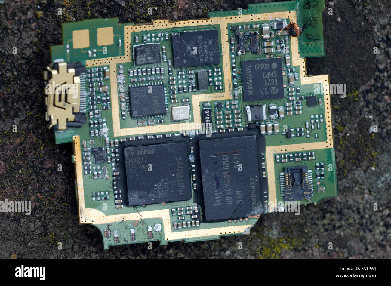 A pile of broken pieces of mobile phones and phone batteries Stock ...