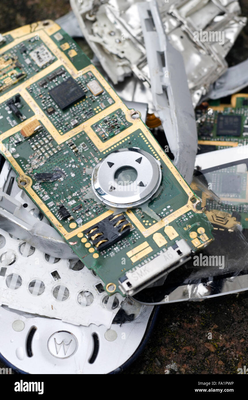 A pile of broken pieces of mobile phones and phone batteries Stock ...