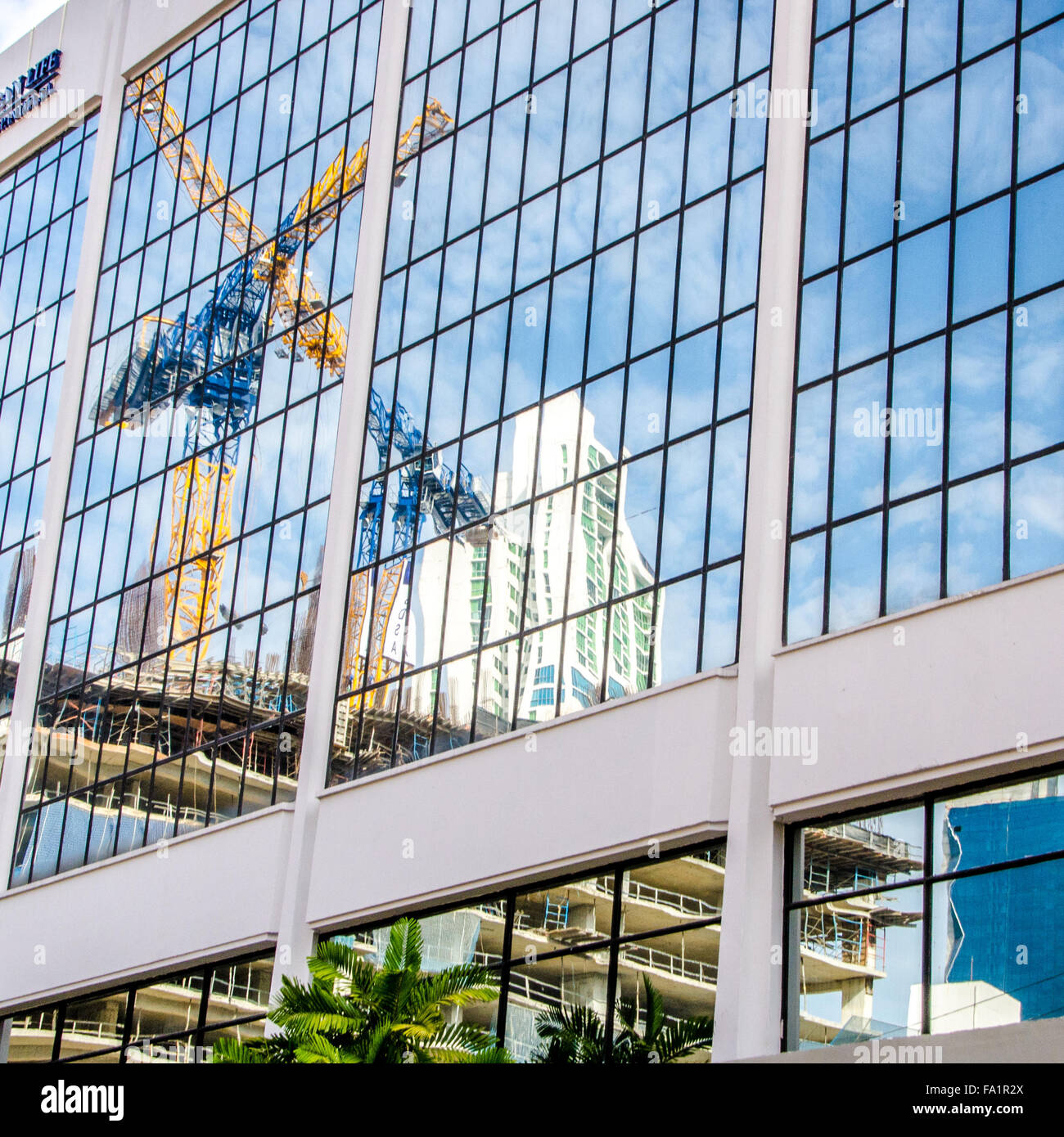 Reflection of cranes and building Panama City, Central America Stock ...