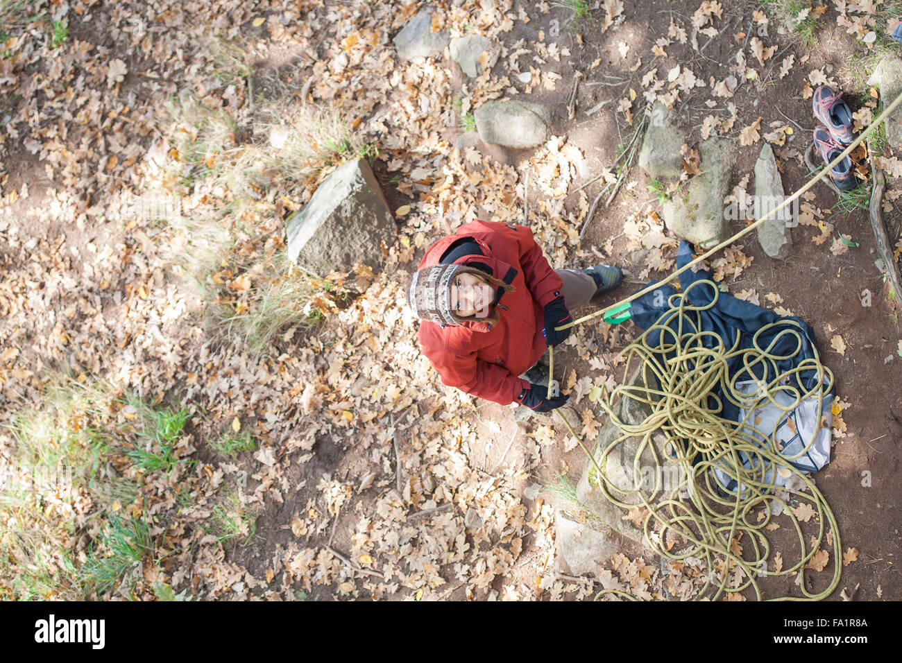 Young man belaying a climber Stock Photo - Alamy