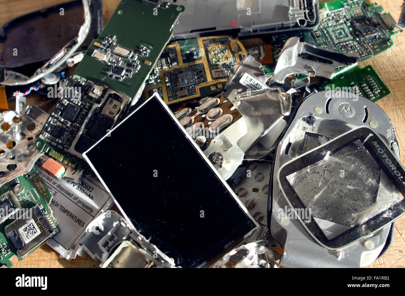 A pile of broken pieces of mobile phones and phone batteries Stock ...
