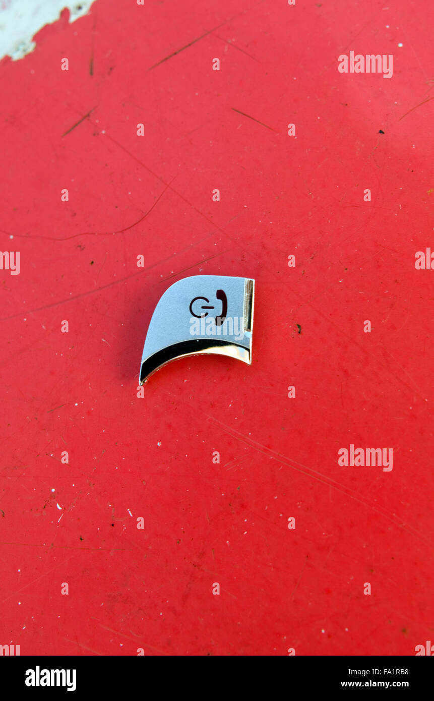 Broken call button from a mobile phone on a dirty red background Stock ...