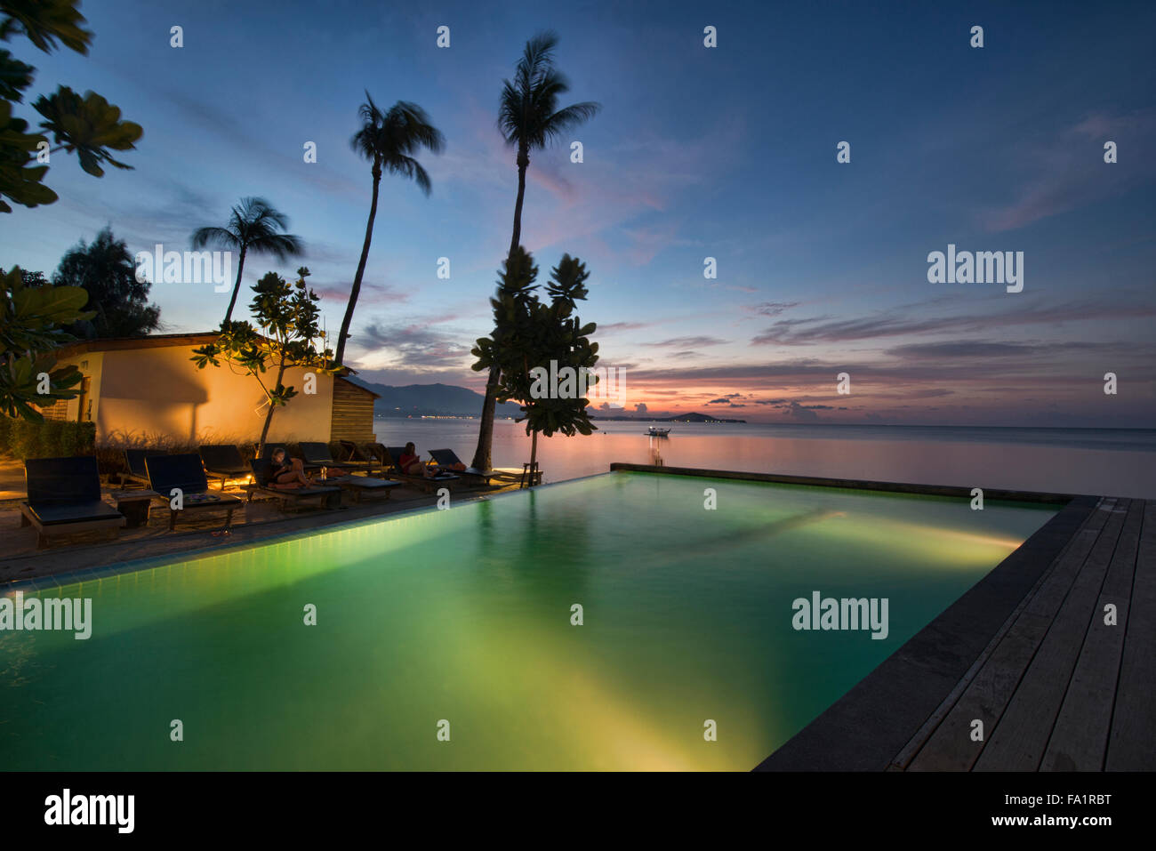 Sunset over an infinity edge pool on Koh Samui island, Thailand Stock ...