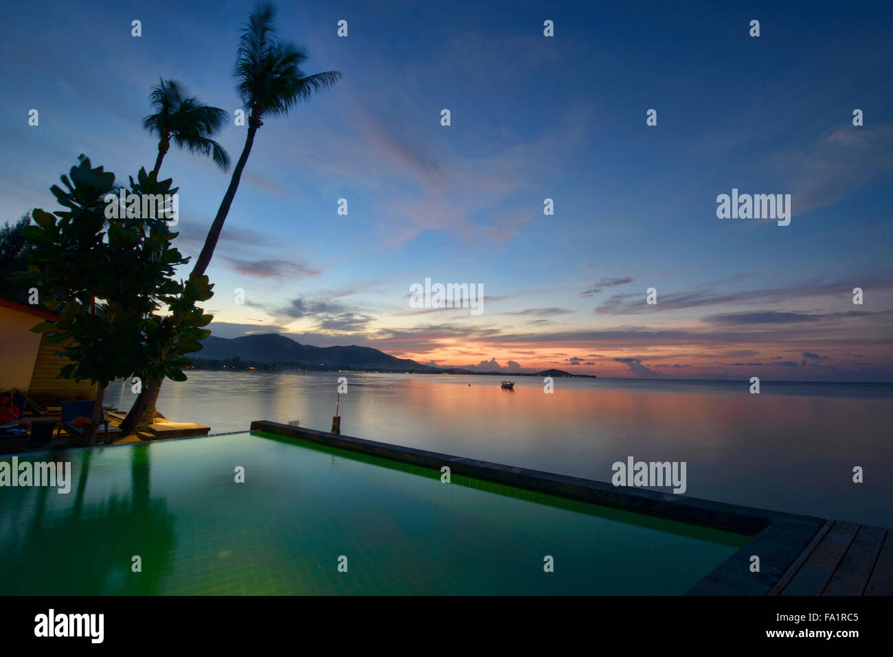 Sunset over an infinity edge pool on Koh Samui island, Thailand Stock ...
